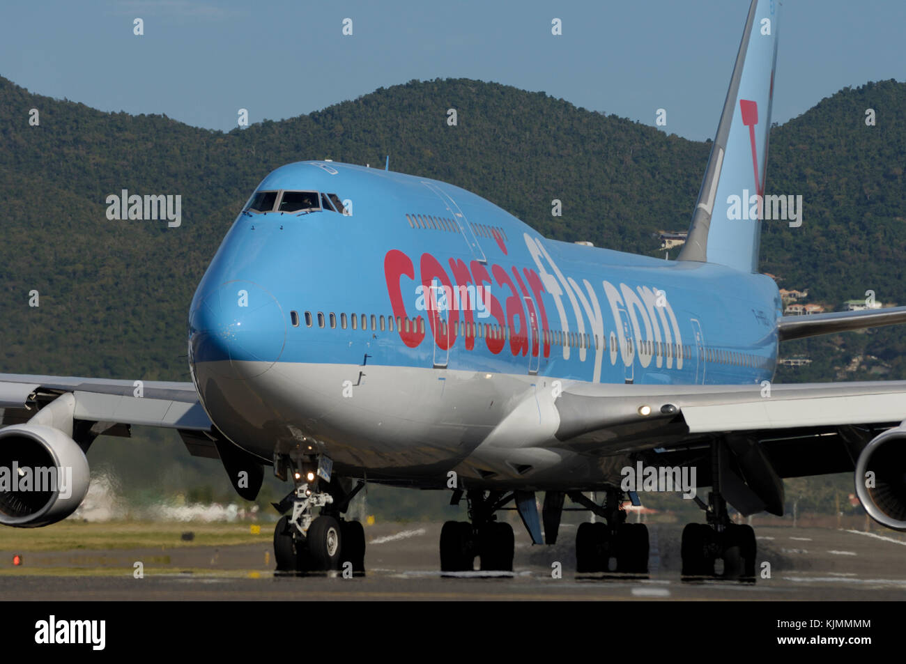 B747 on the runway with hills behind Stock Photo - Alamy