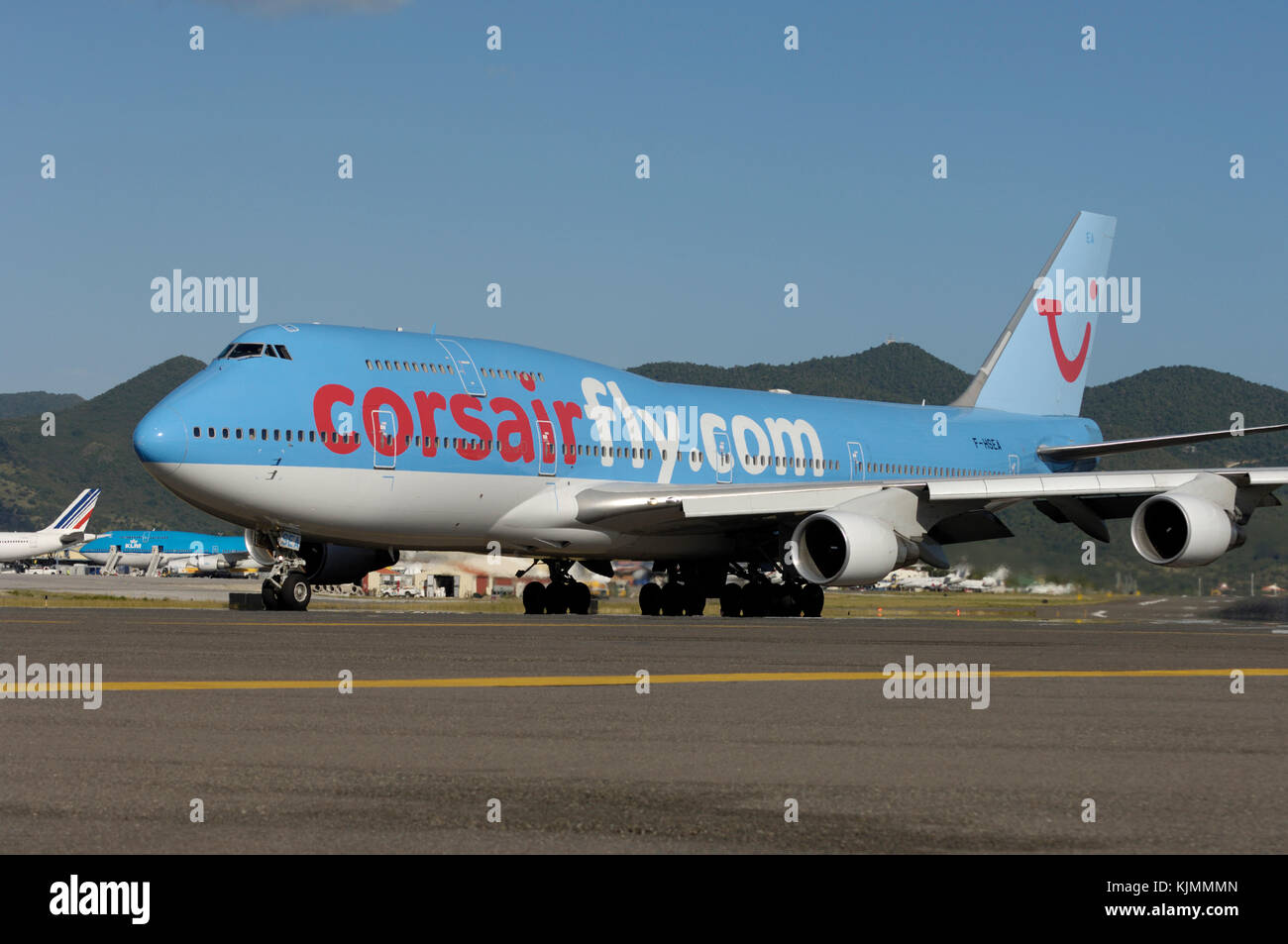 B747 on the runway with hills behind Stock Photo - Alamy