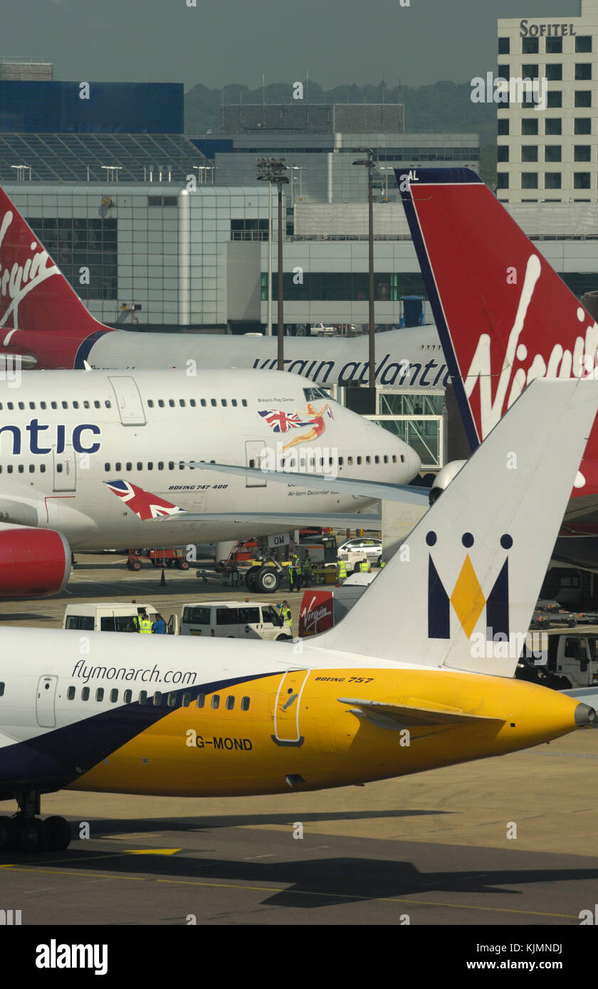 a Monarch Boeing 757-200, three Virgin Atlantic 747-400s parked at the ...