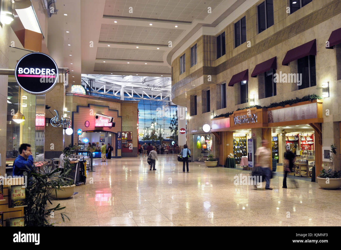 passengers walking past Borders and Made in Washington shops in the ...