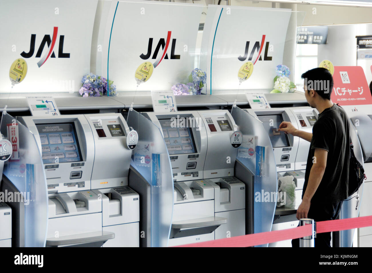 passengers using e-ticket, e-check-in kiosk machines in main airport ...