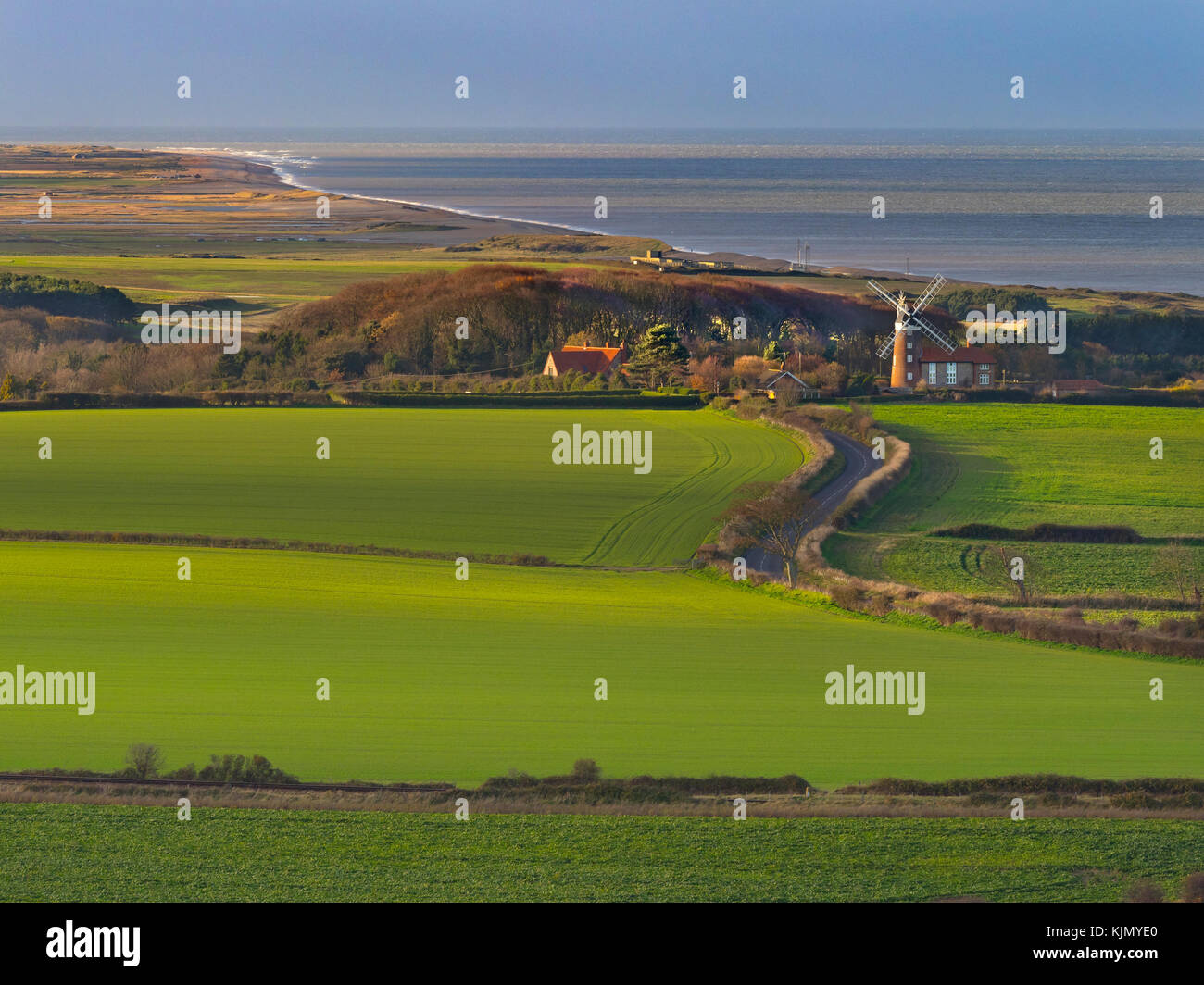 Windmill and North sea Weybourne and north Norfolk coast Stock Photo ...