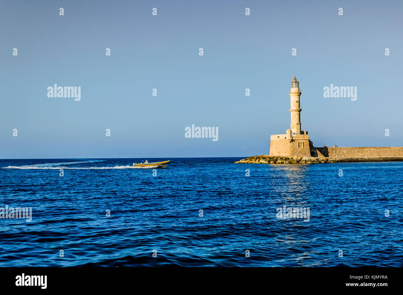 The lighthouse at the entrance to the port Stock Photo - Alamy
