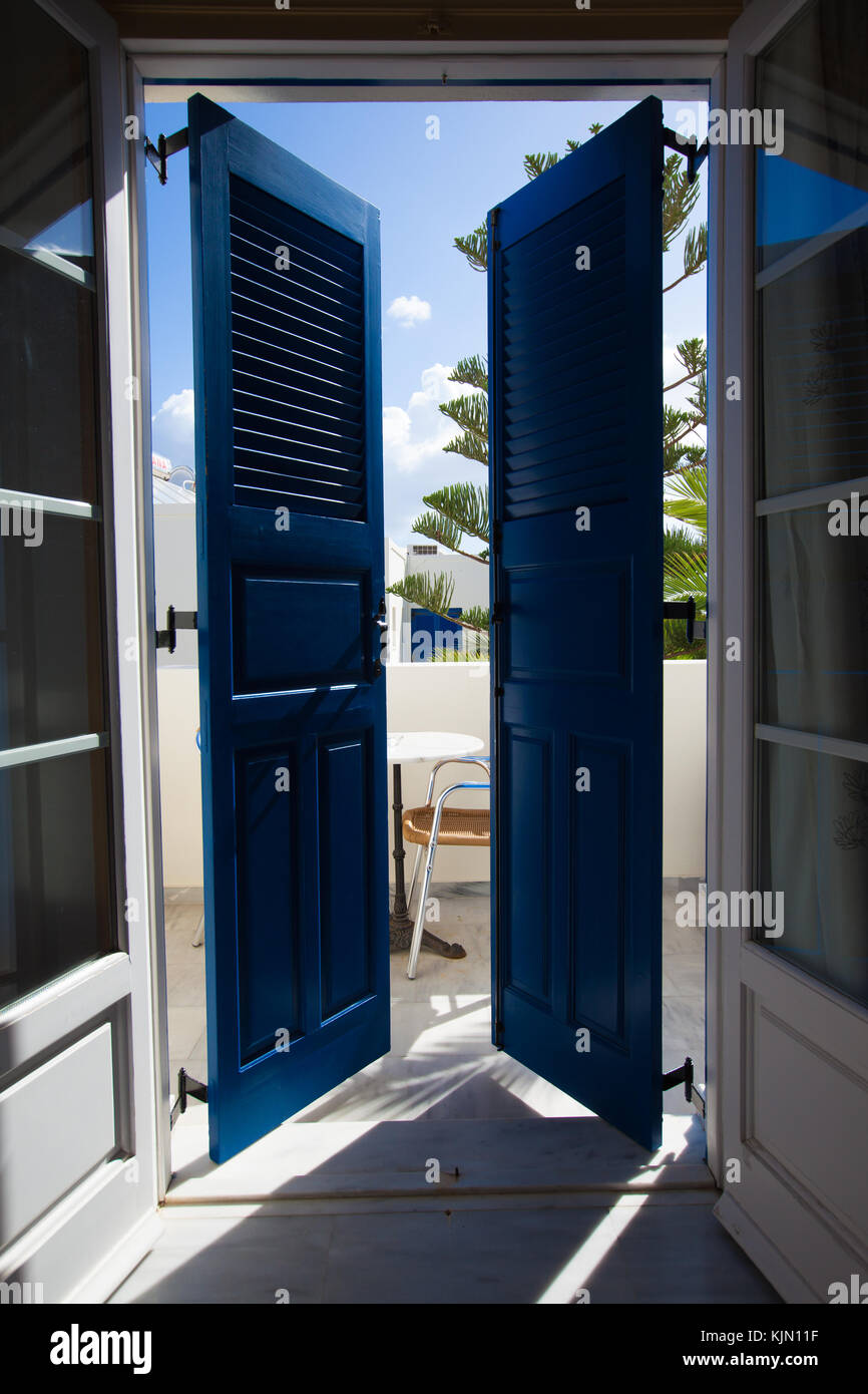 Blue door and window with shutters Stock Photo - Alamy