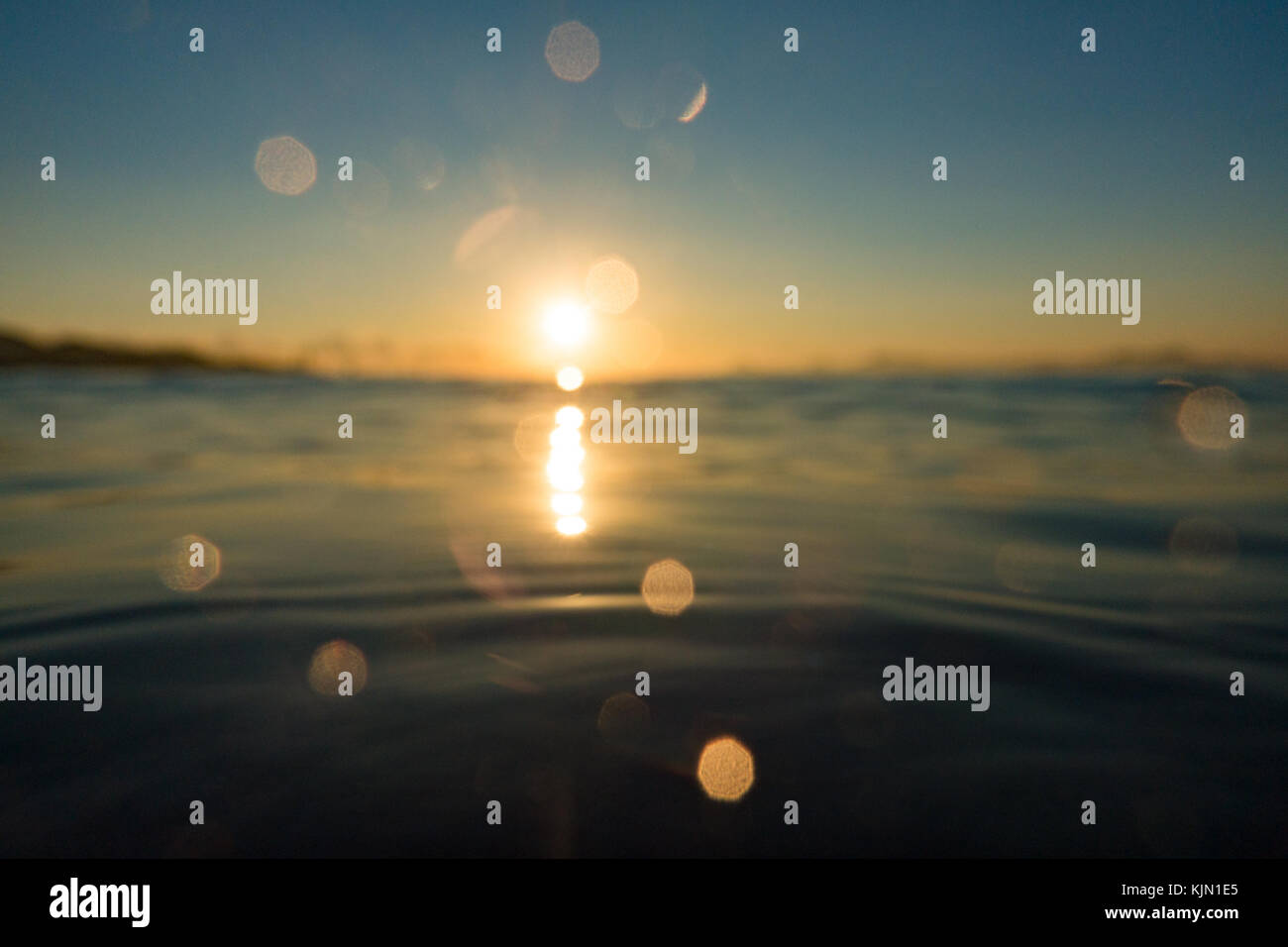 Sunset with underwater part by waterline Stock Photo - Alamy