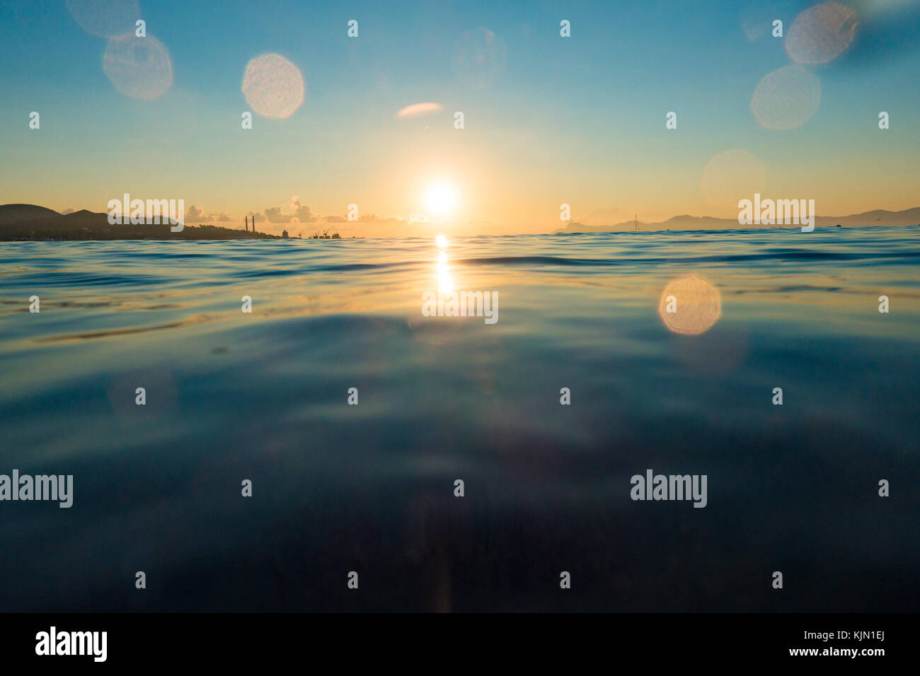 Sunset with underwater part by waterline Stock Photo - Alamy