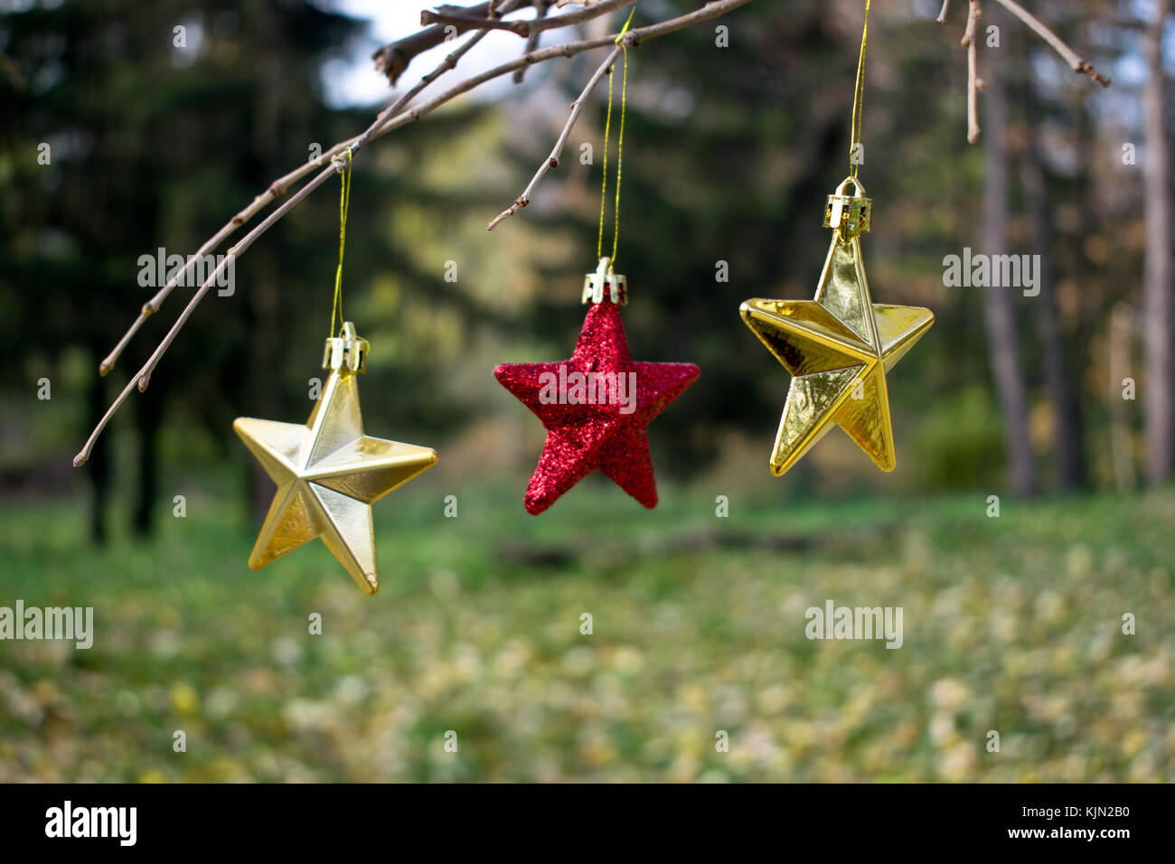 three glowing stars decoration celebrate christmas Stock Photo - Alamy