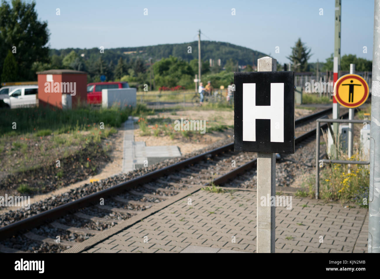 Stop sign on rail station Stock Photo - Alamy