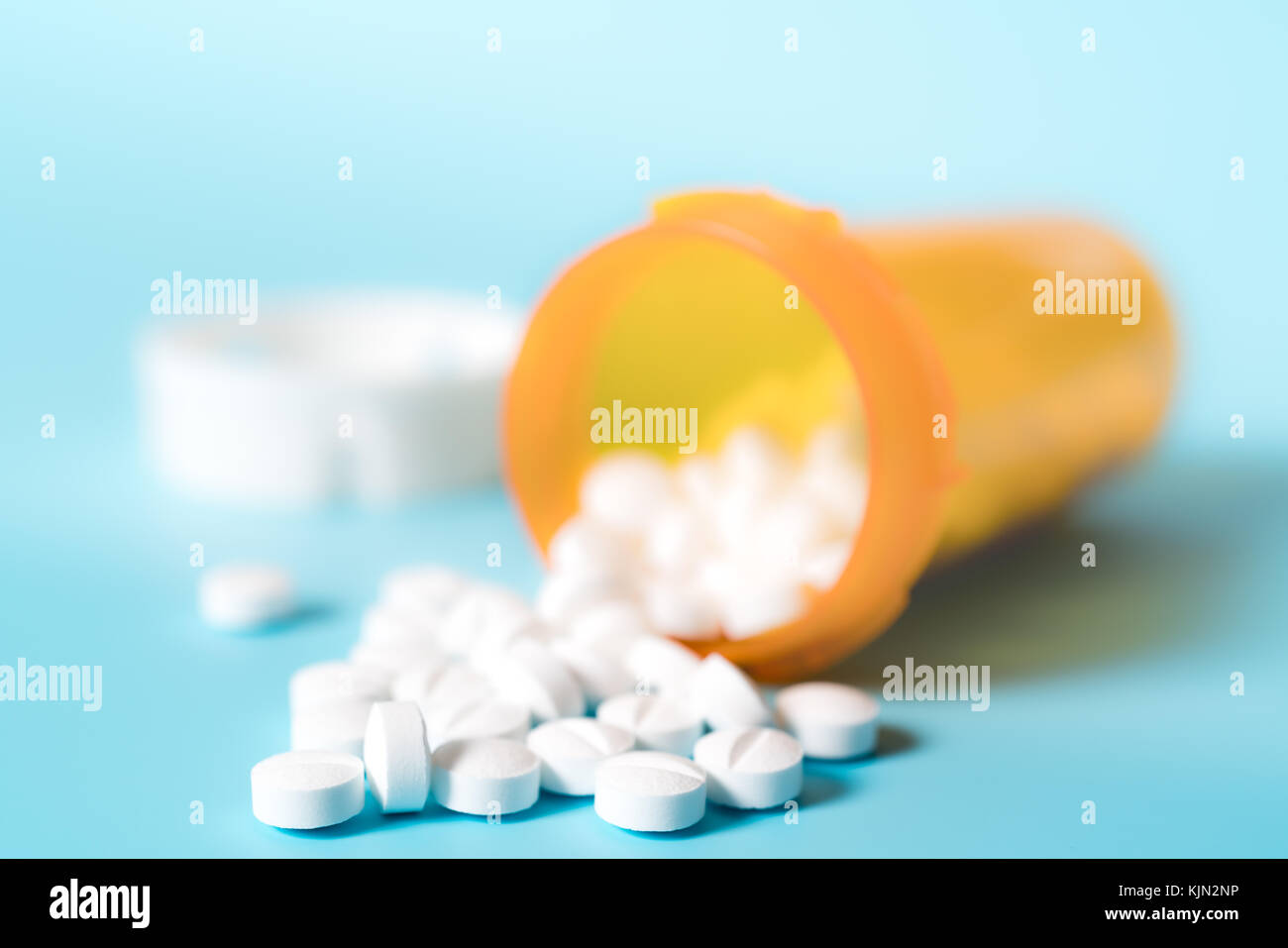 White tablets in a plastic container Stock Photo - Alamy