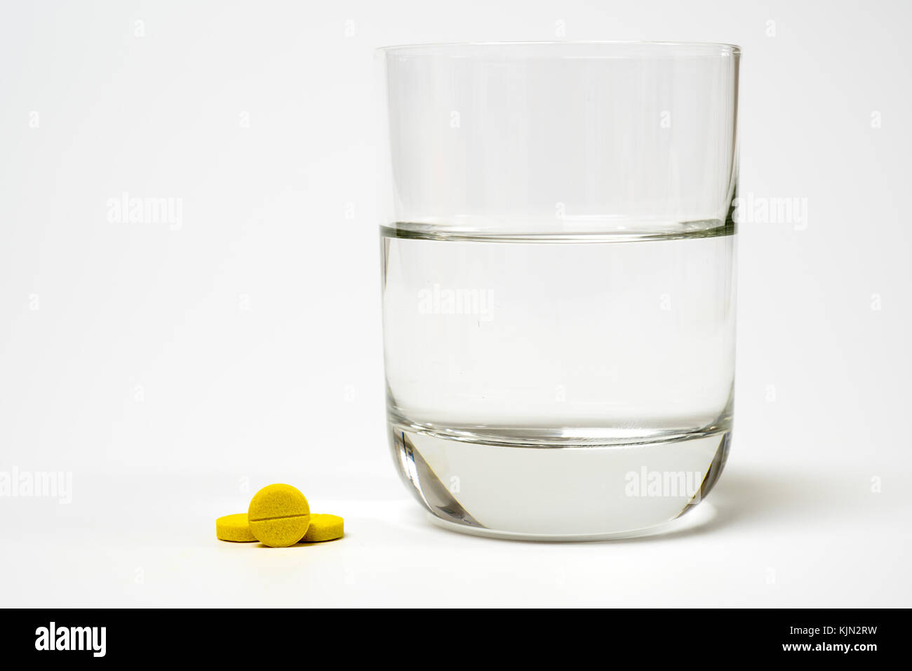 Pills and medication and a glass with water on a white background Stock ...