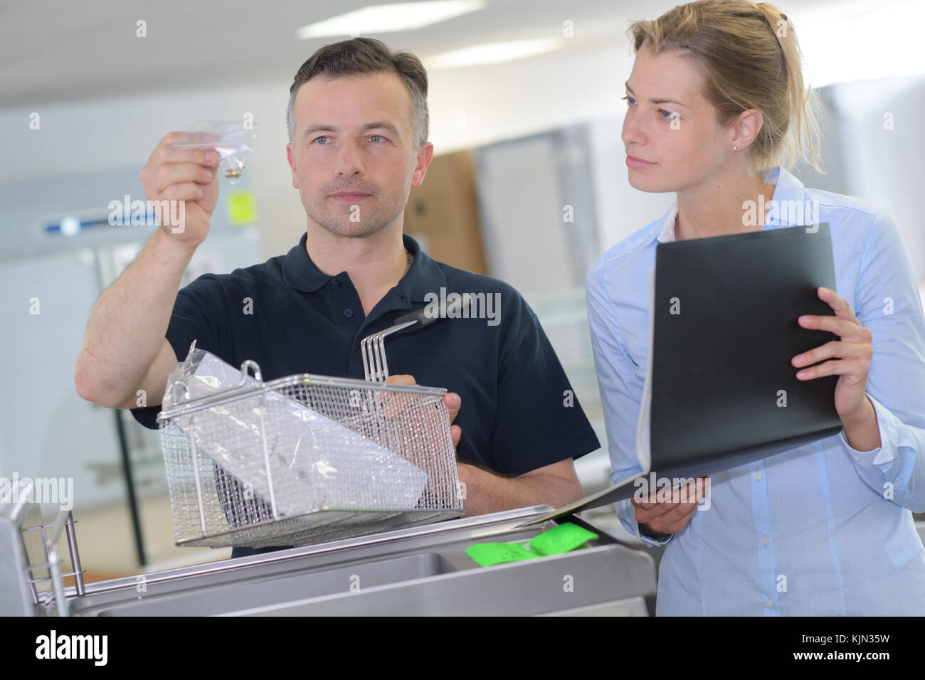 lab technician with an urine specimen on a table Stock Photo - Alamy