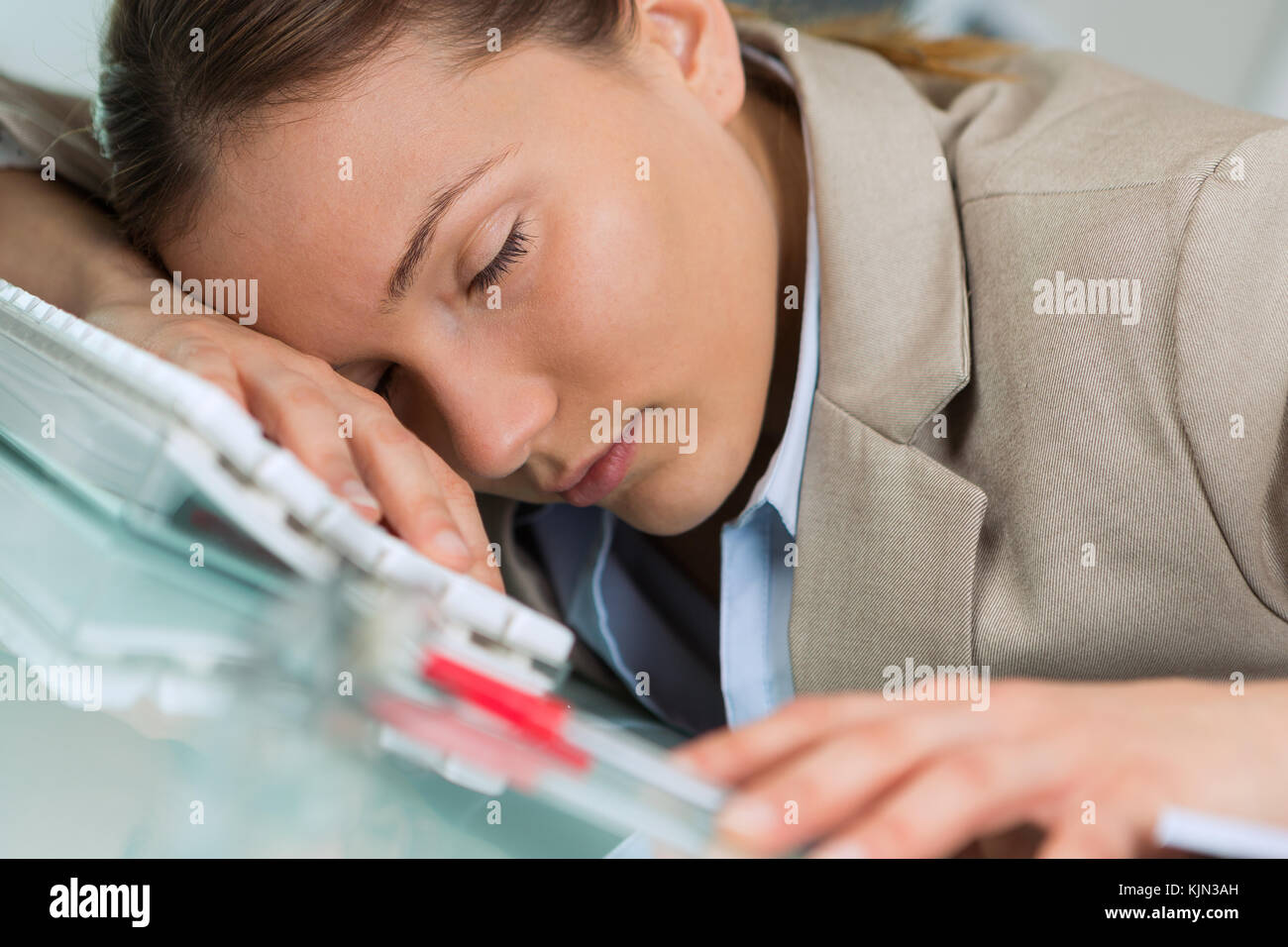 businesswoman sleeping in office Stock Photo - Alamy