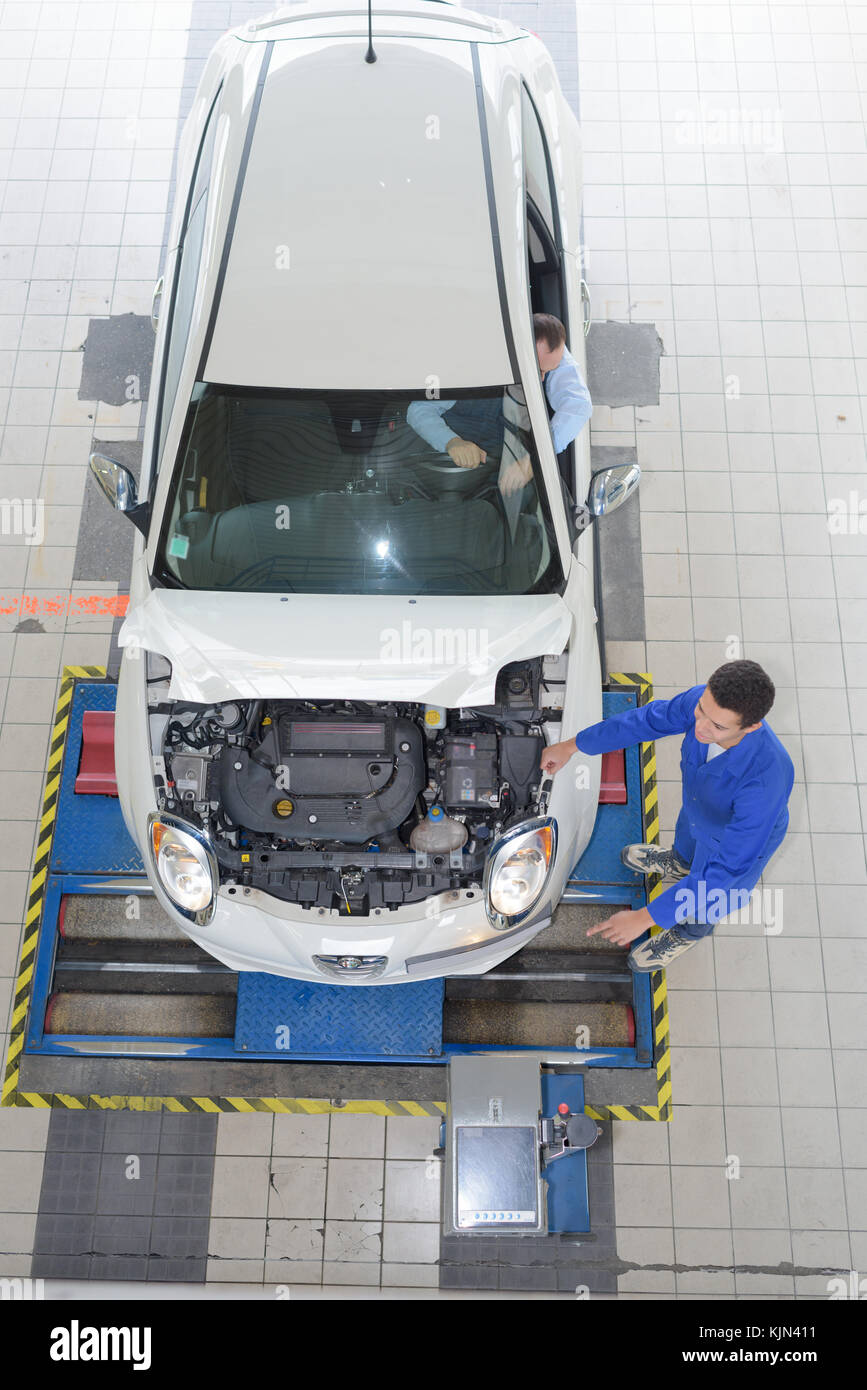 Downward view of car on rolling road Stock Photo - Alamy