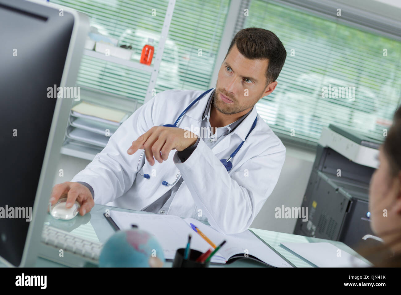 general doctor showing the result Stock Photo - Alamy