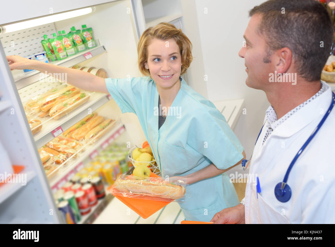 medical doctor with nurse during lunchbreak Stock Photo - Alamy