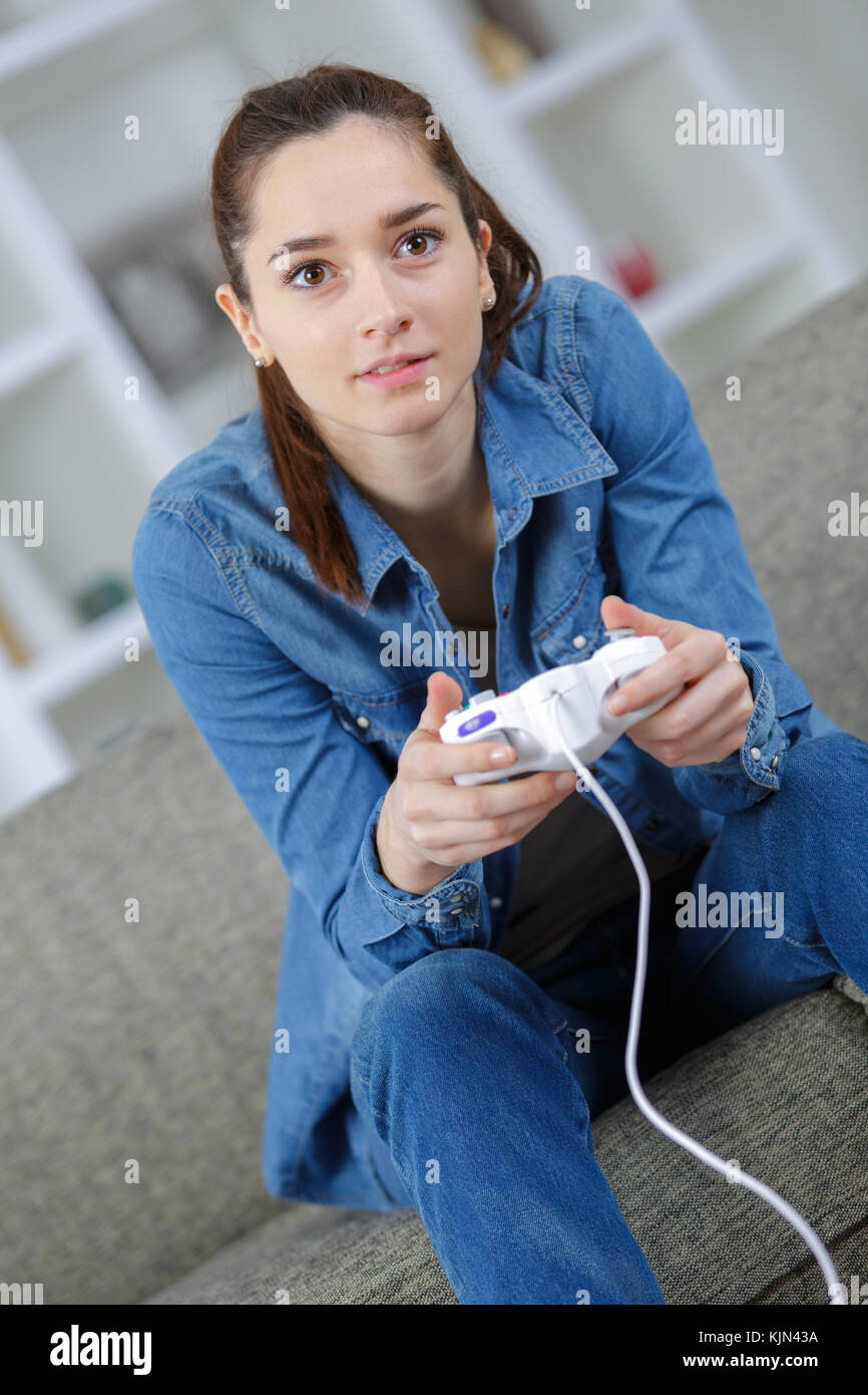 girl playing video game in room Stock Photo - Alamy
