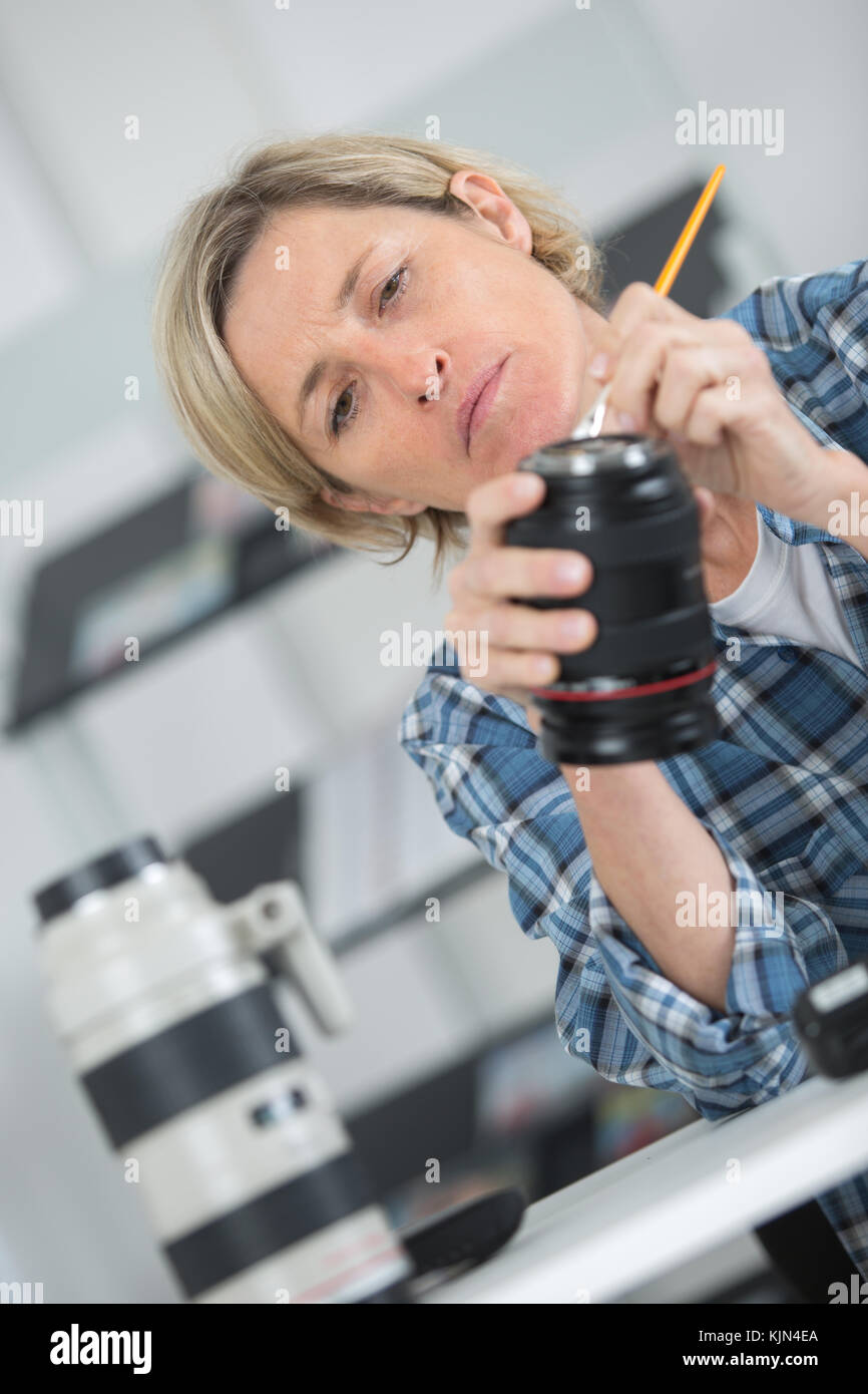 Woman engineer repairing camera hi-res stock photography and images - Alamy