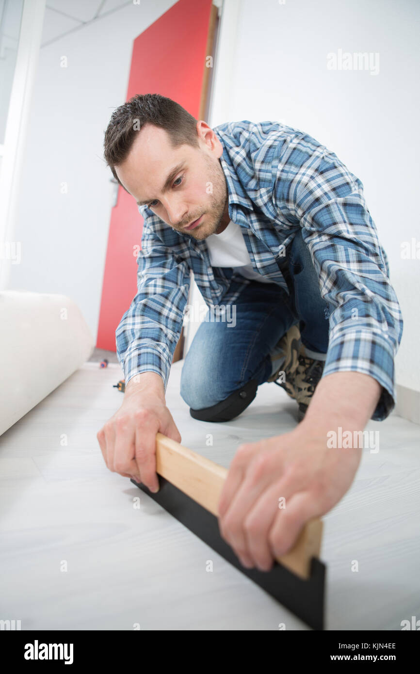 construction worker flooring Stock Photo - Alamy