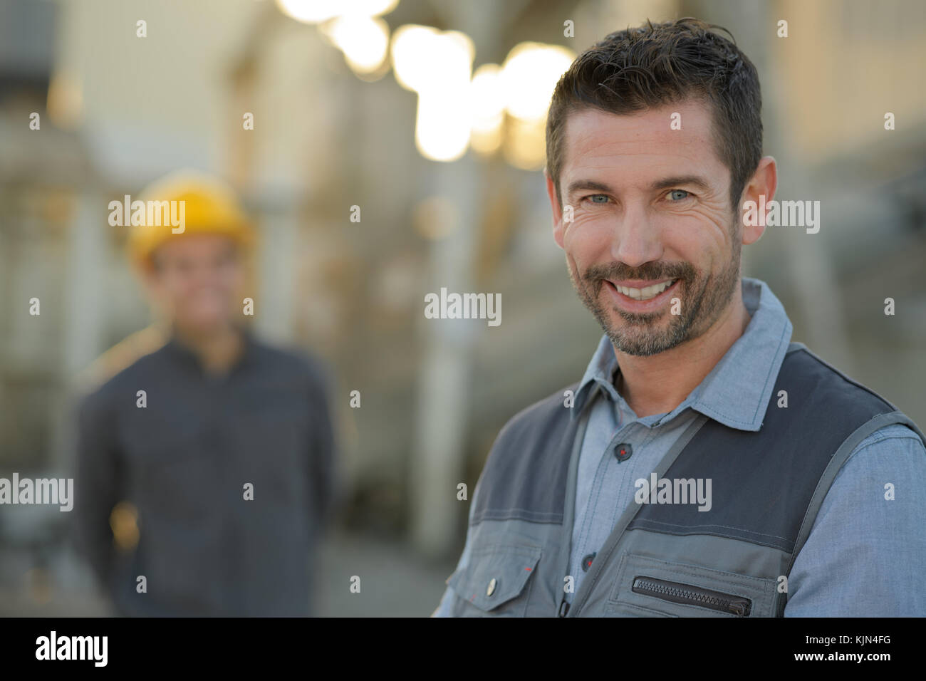 smiling happy handsome warehouse worker Stock Photo - Alamy