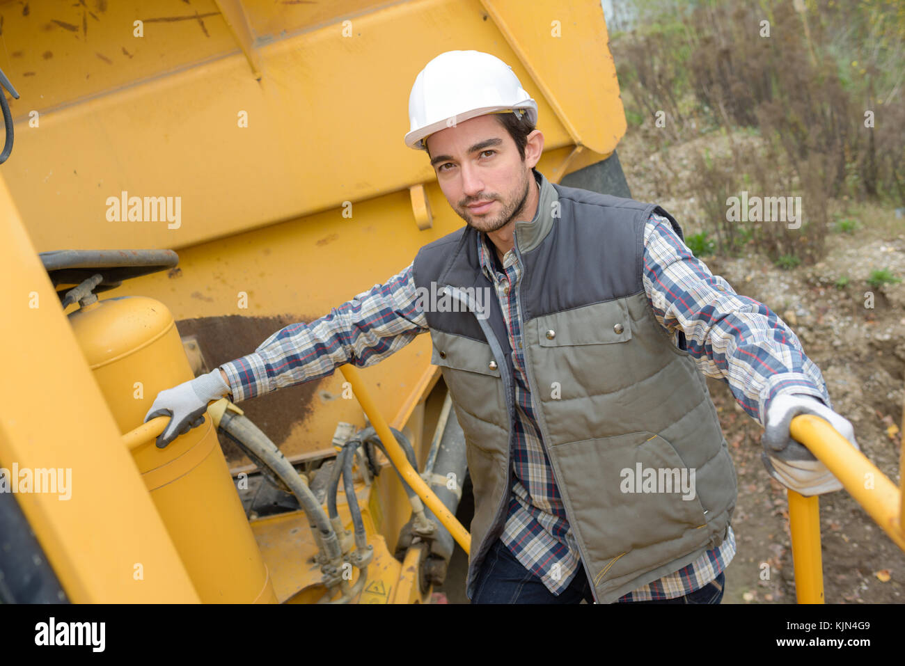 posing on a heavy equipment Stock Photo - Alamy