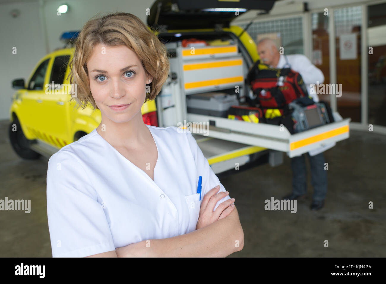 nurse posing next to a medical car Stock Photo - Alamy