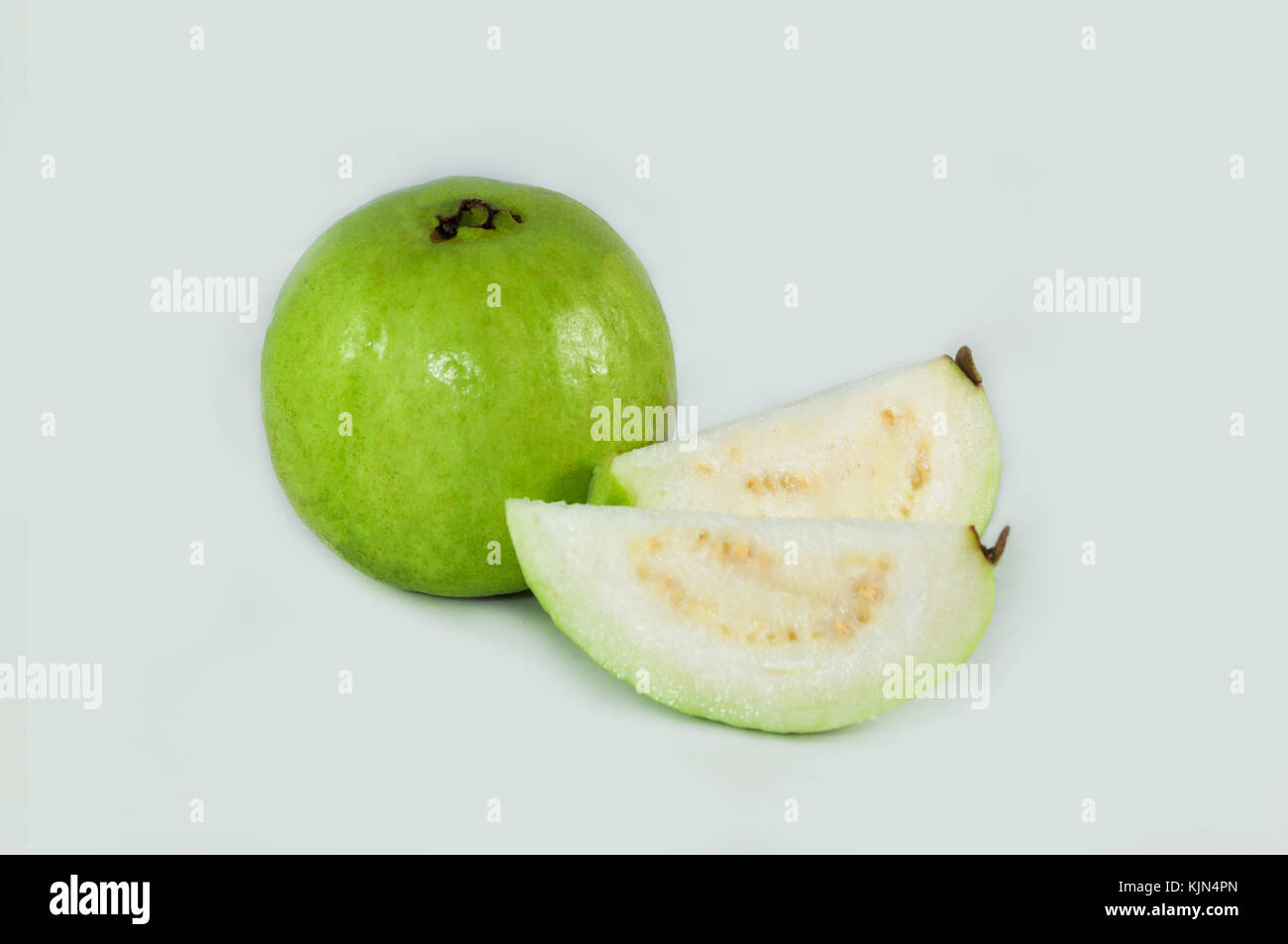 Guava with 2 slice on isolated background Asia Vietnam Stock Photo - Alamy