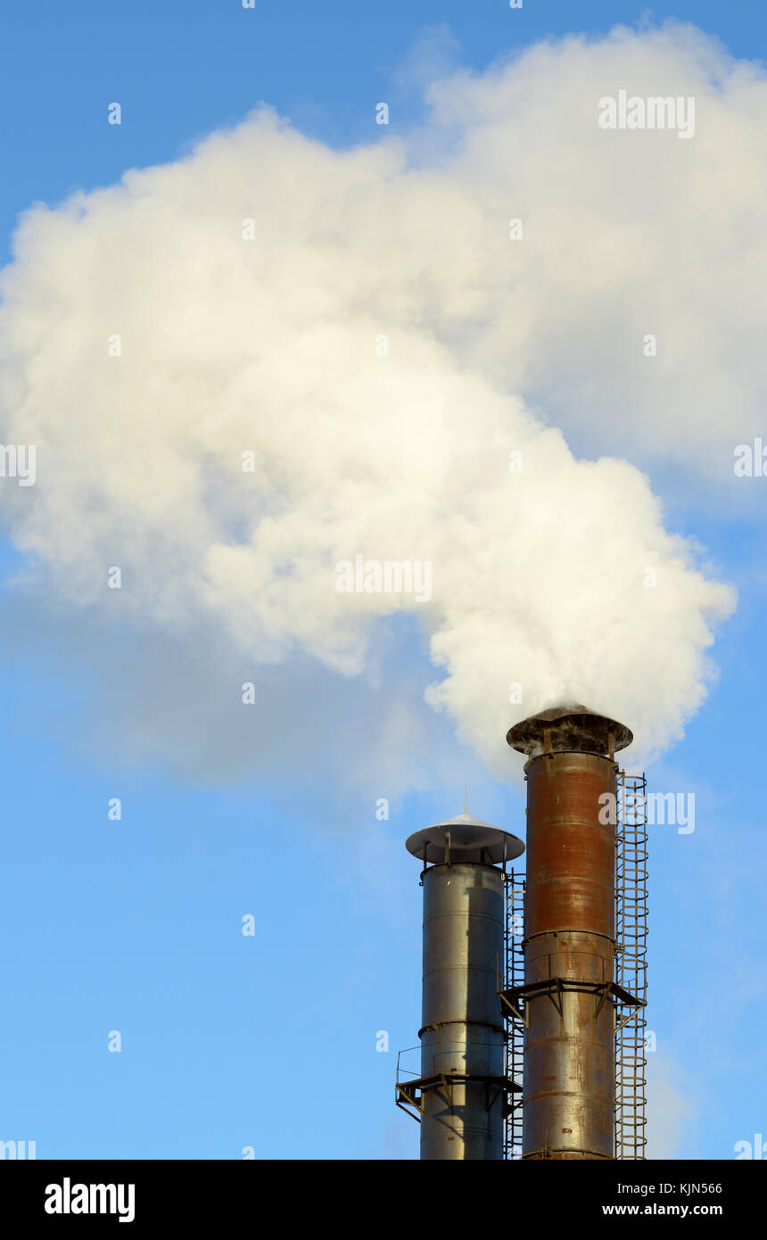 Thick smoke coming from factory chimneys.A beautiful phenomenon on the ...