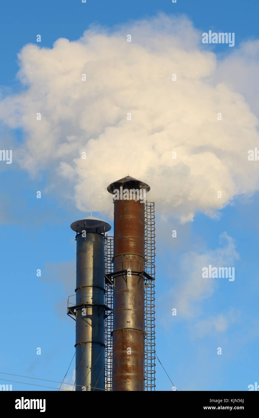 Thick smoke coming from factory chimneys.A beautiful phenomenon on the ...