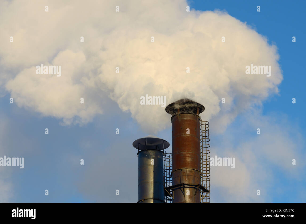 Thick smoke coming from factory chimneys.A beautiful phenomenon on the ...