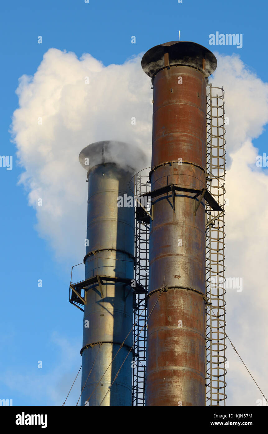 Thick smoke coming from factory chimneys.A beautiful phenomenon on the ...