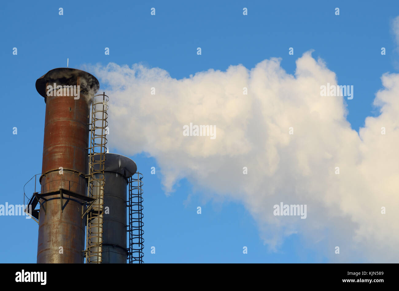 Thick smoke coming from factory chimneys.A beautiful phenomenon on the ...
