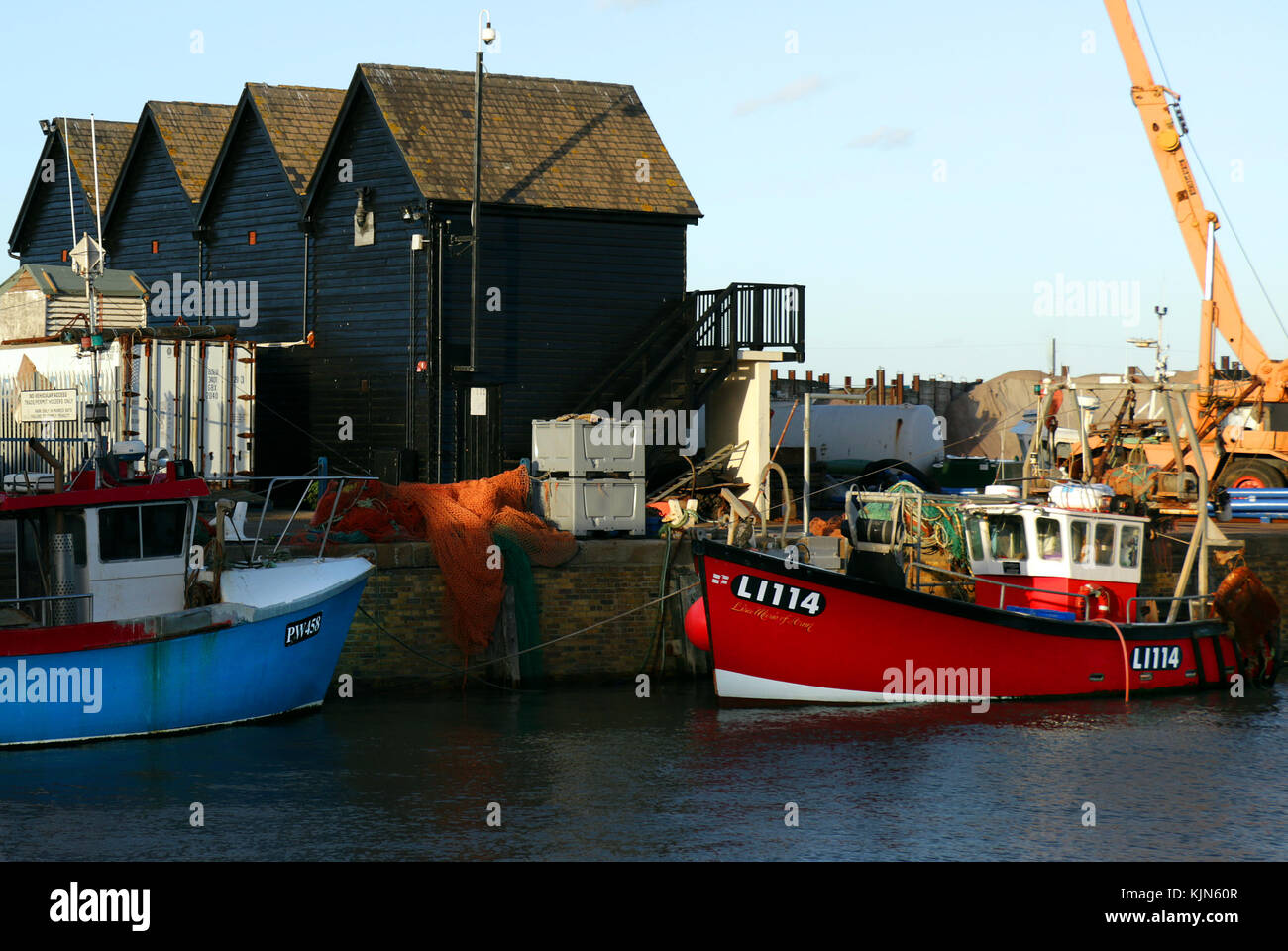 Fishing boats in Whitstable harbour Stock Photo - Alamy