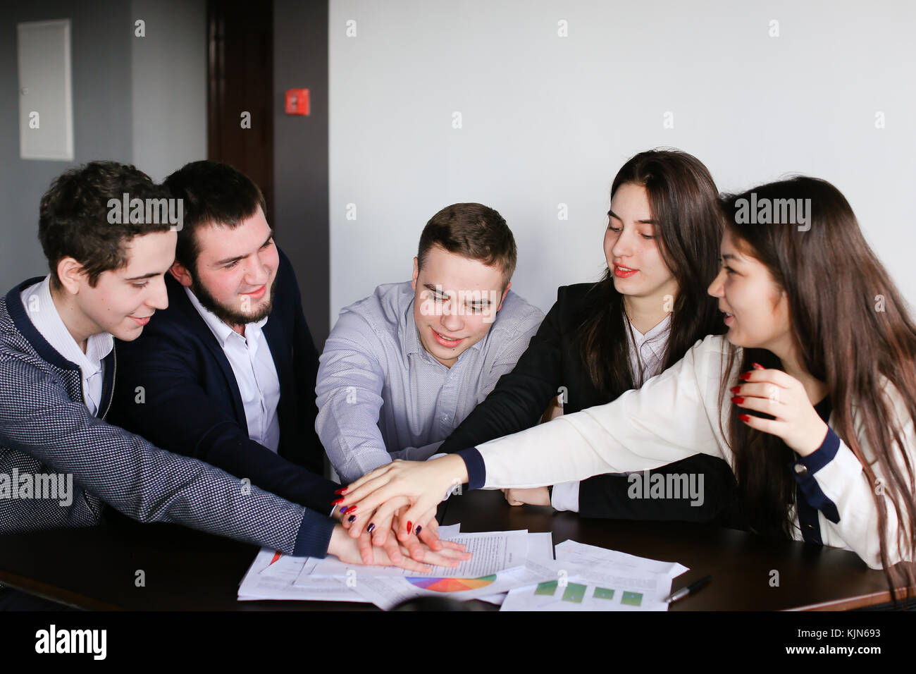 Ambitious employees of company work in team and successfully con Stock ...