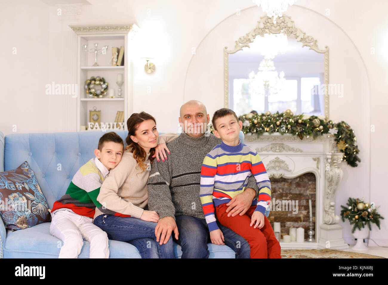 Happy and cheerful family in festive mood have fun and laugh tog Stock ...