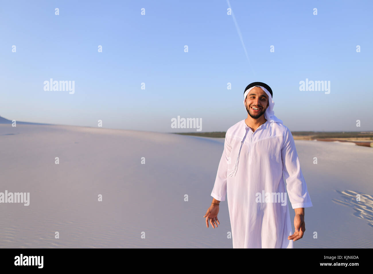 Happy male arab walks hi-res stock photography and images - Alamy