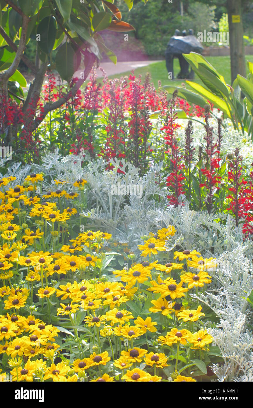 Garden with plenty of blooming Flowers Stock Photo - Alamy