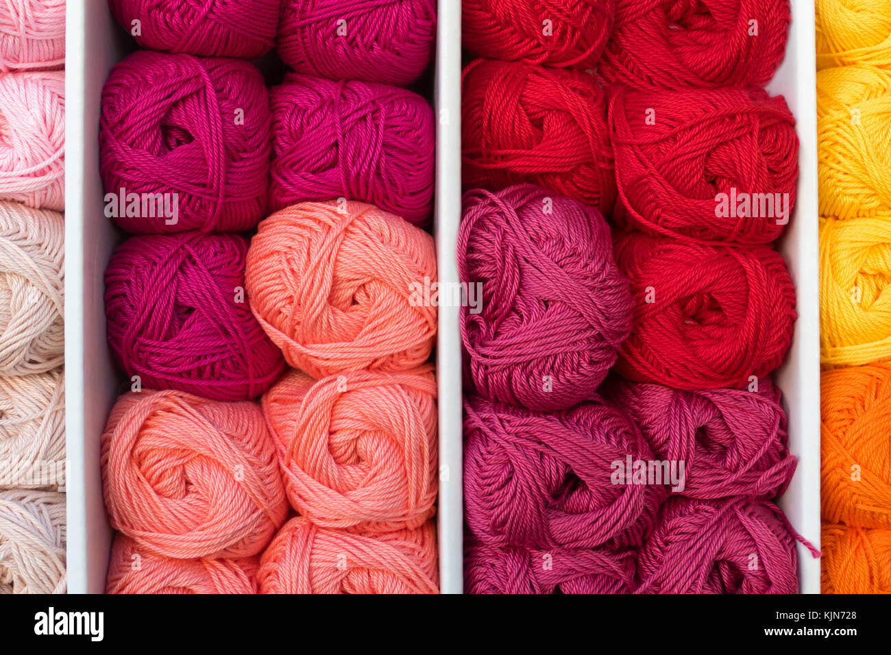Stacked colorful ball of wool in a box Stock Photo - Alamy