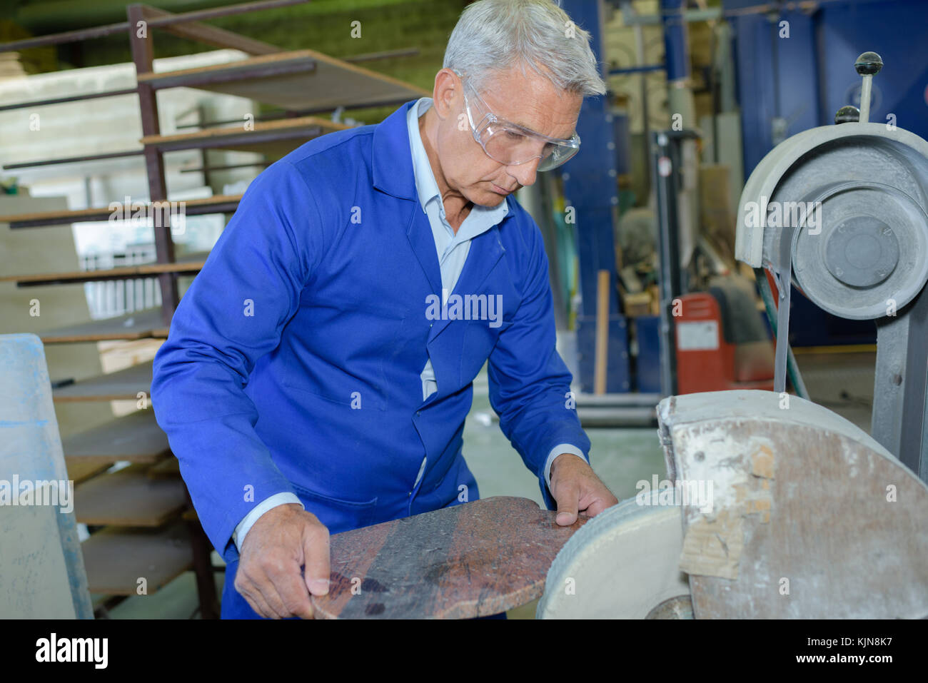 Man grinding marble Stock Photo - Alamy