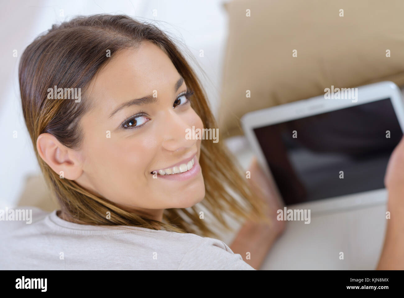smiling beautiful woman with tablet Stock Photo - Alamy