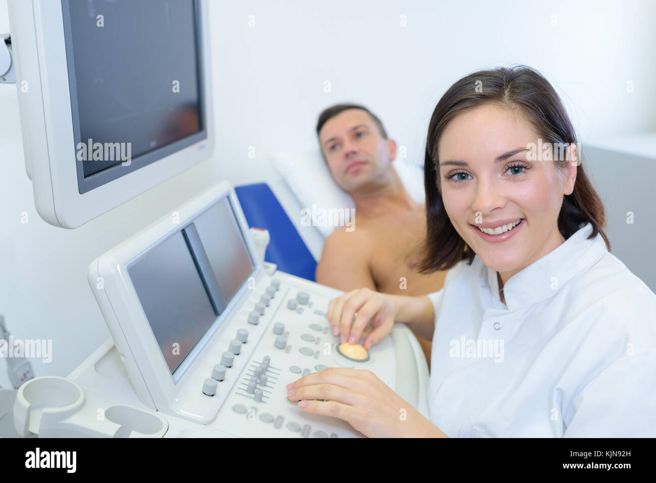 Portrait of nurse performing scan on patient Stock Photo - Alamy