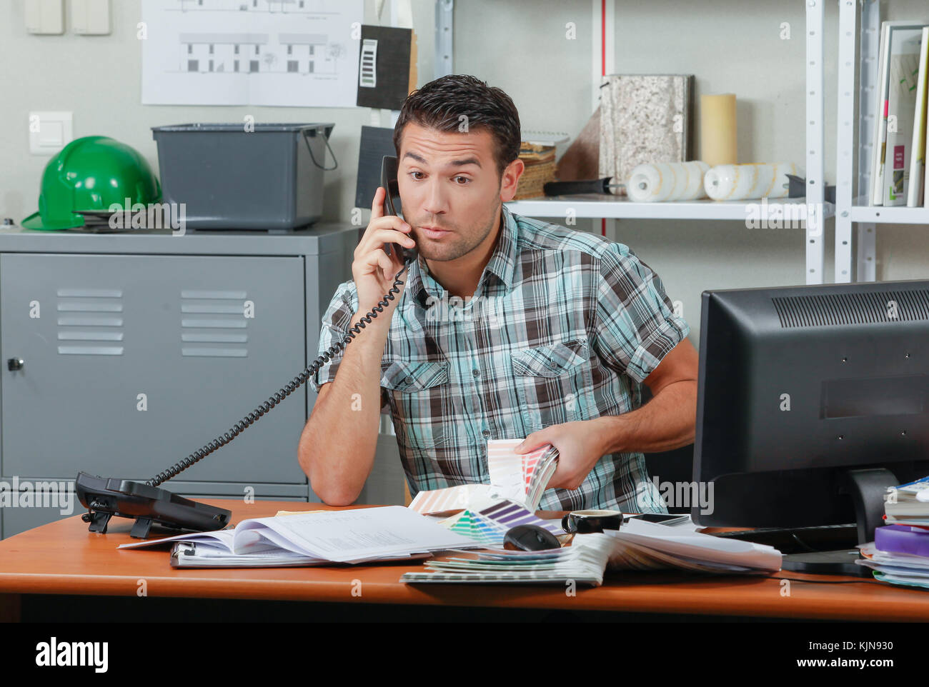 Shocked by phone call Stock Photo - Alamy