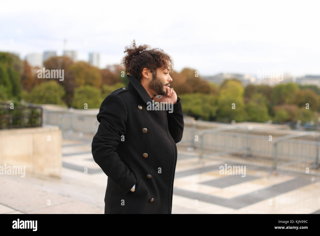 Foreign boyfriend chatting with French girl on smartphone around Stock ...