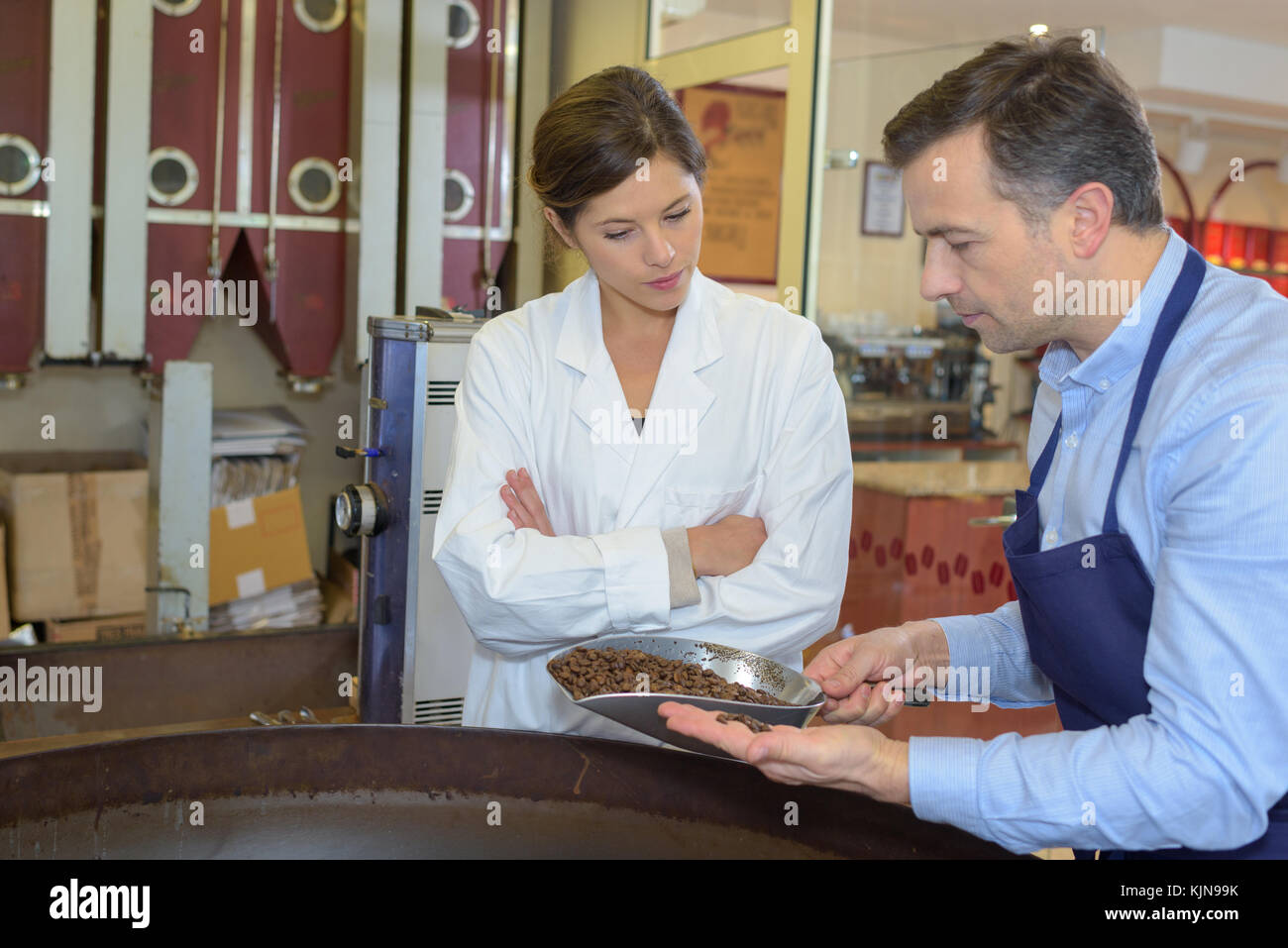 supervisor inspecting the coffee Stock Photo - Alamy