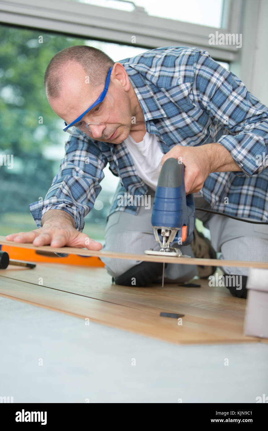carpenter working with cutting tool Stock Photo - Alamy