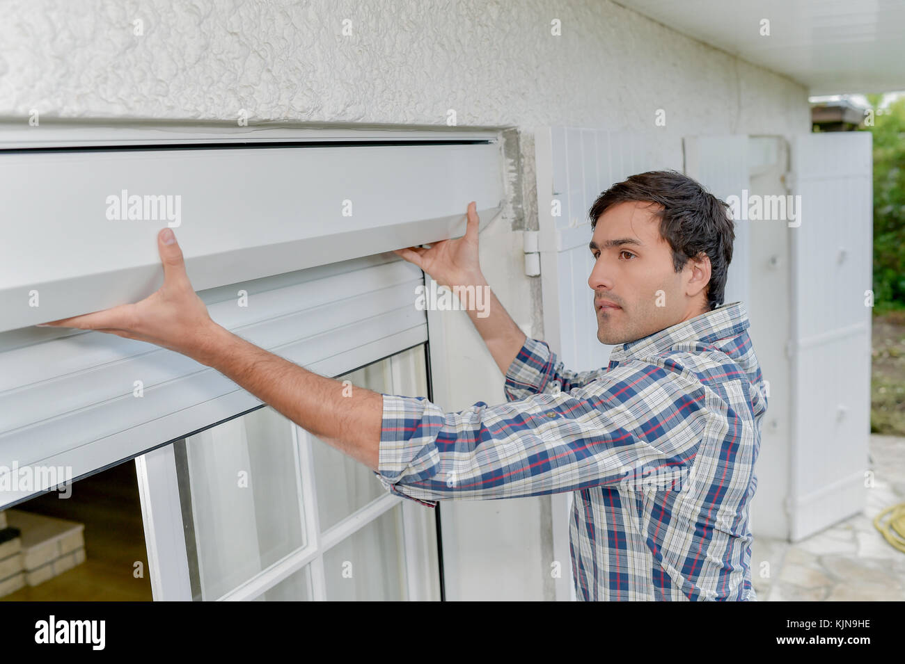 Fitting a new shutter system Stock Photo - Alamy