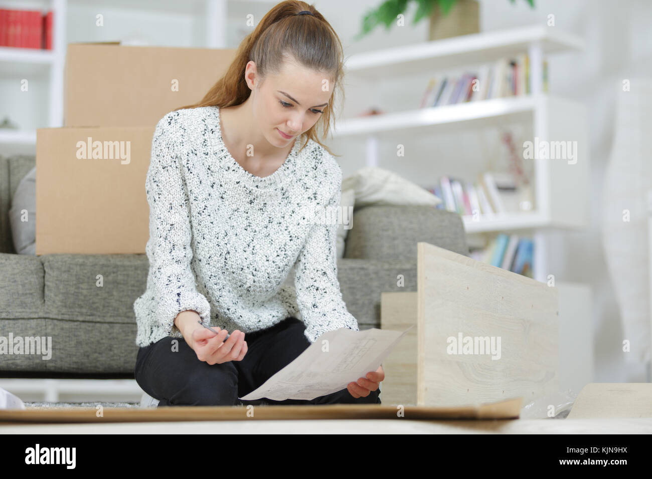 Woman reading an instruction manual hi-res stock photography and images ...