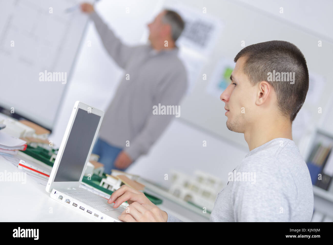 student with laptop studying in the university class Stock Photo - Alamy