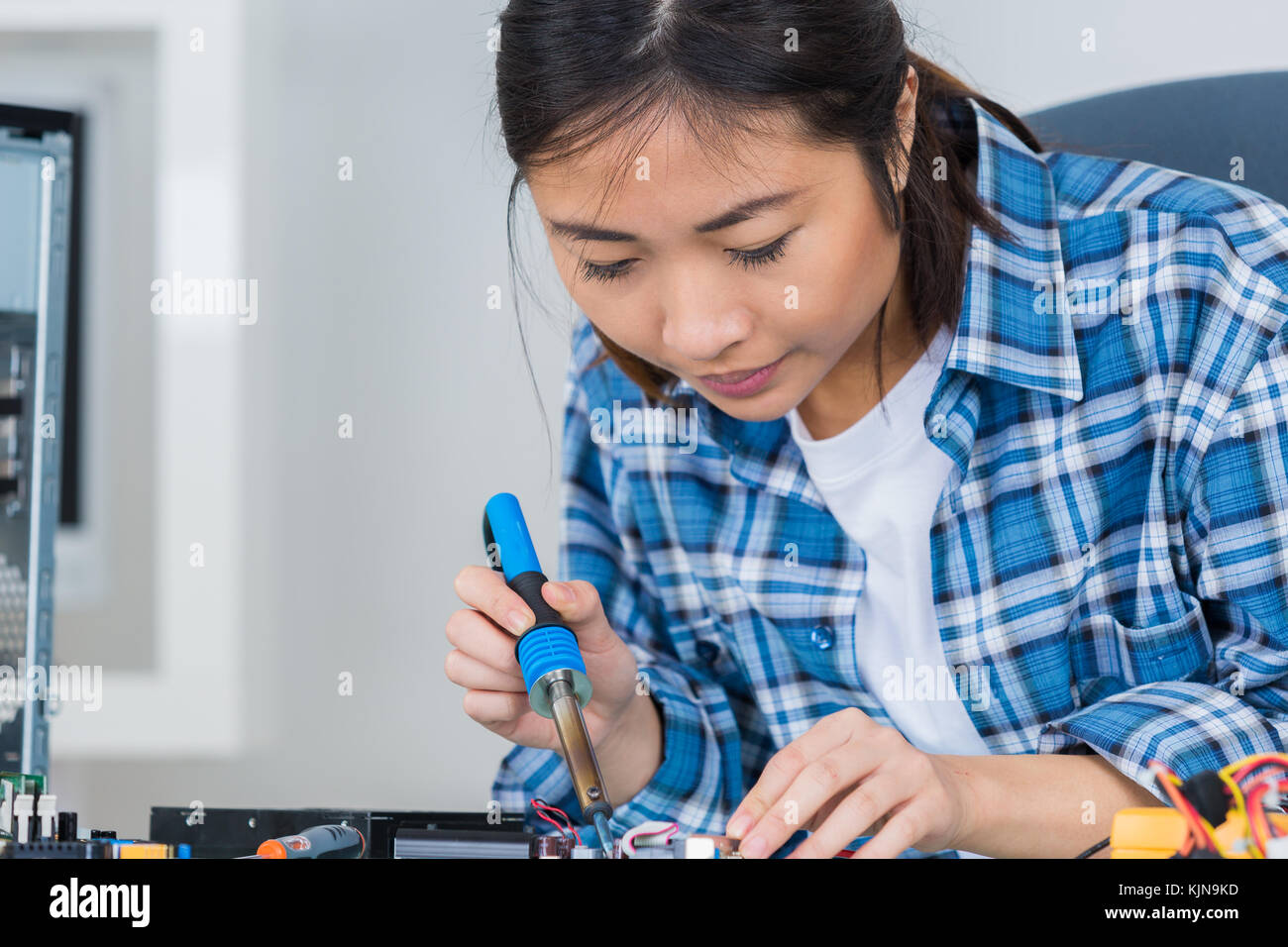cute female engineer at home working on technology Stock Photo - Alamy
