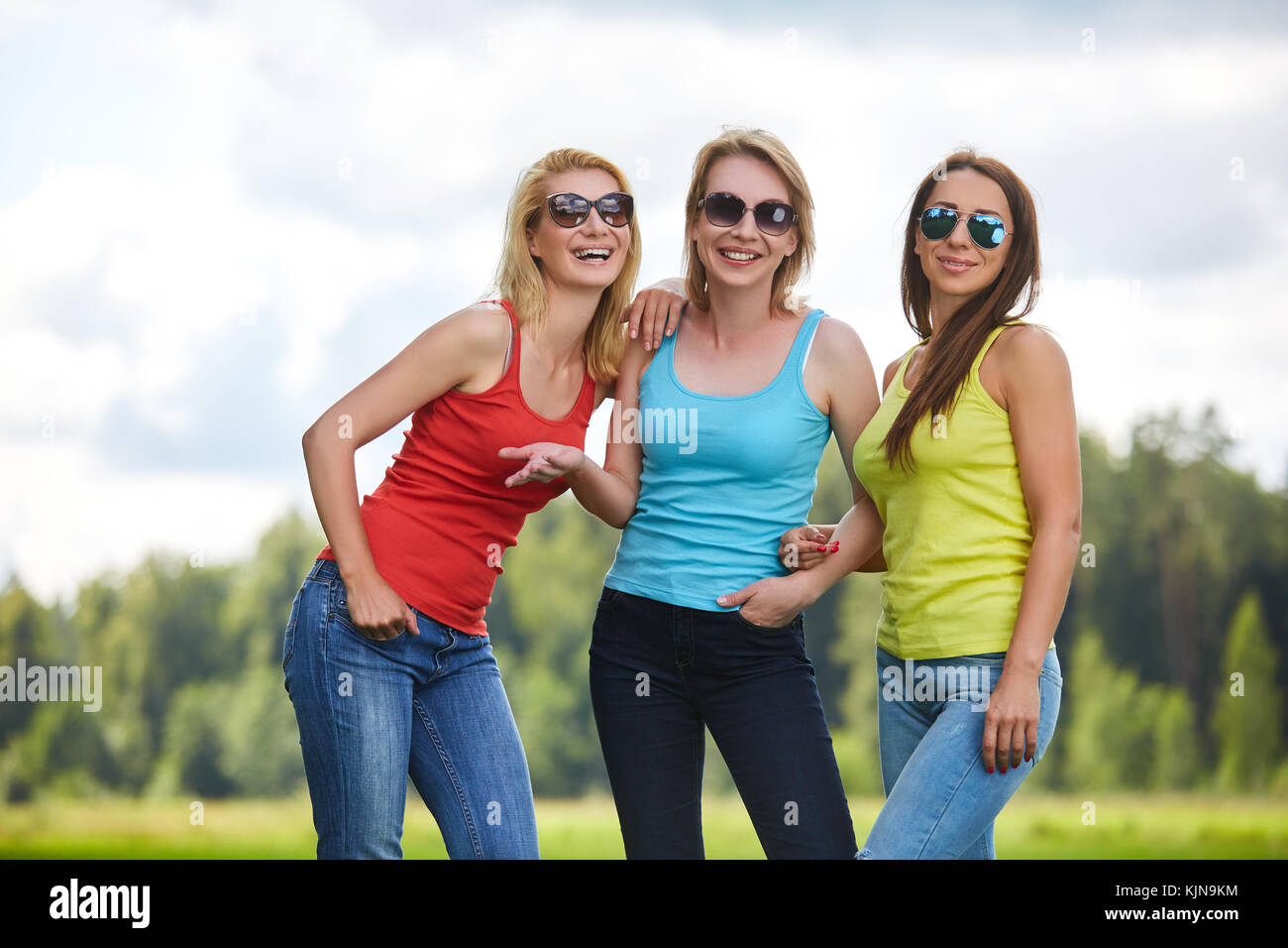 three girls having fun outdoors Stock Photo - Alamy