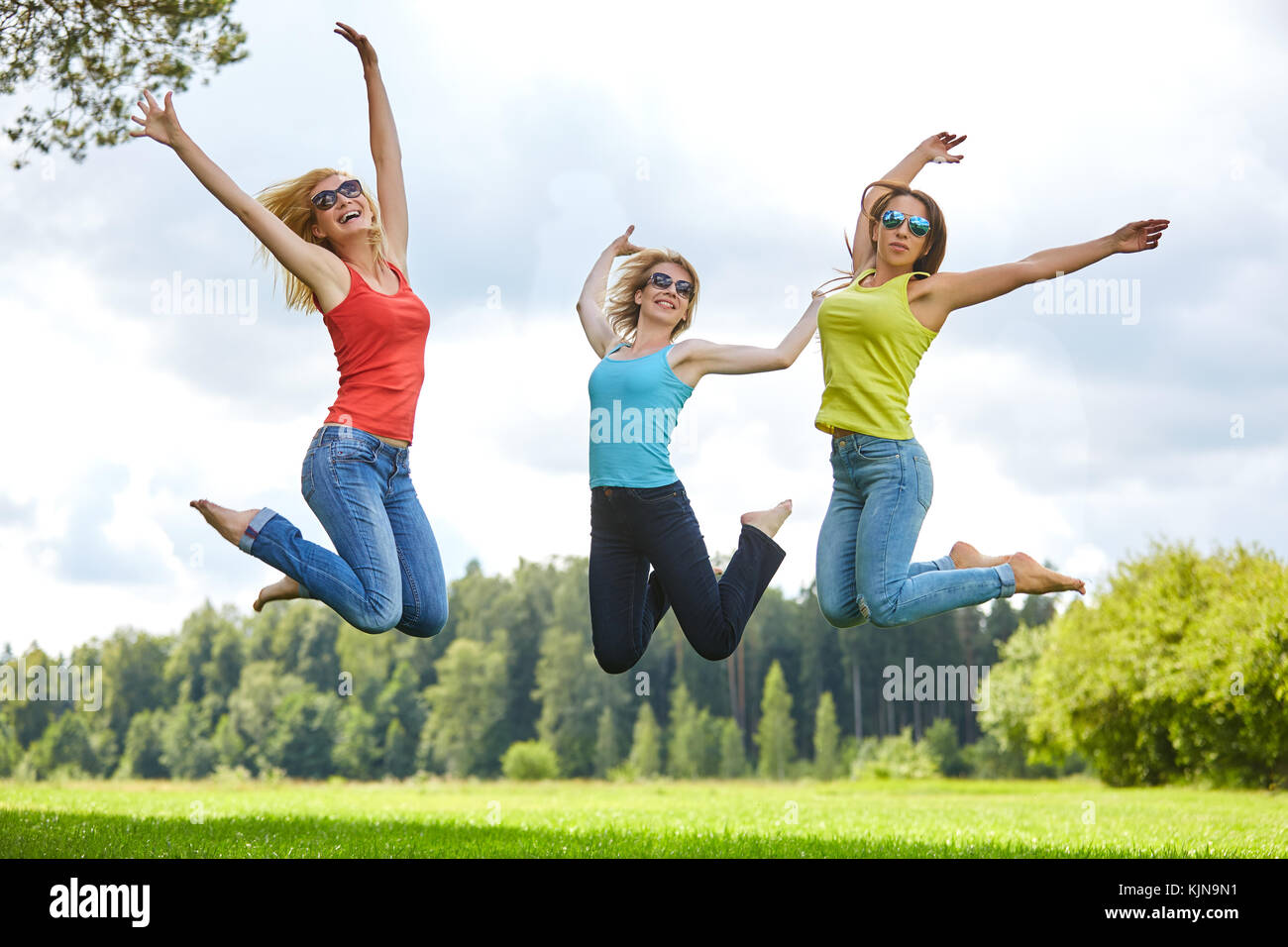 three girls having fun outdoors Stock Photo - Alamy
